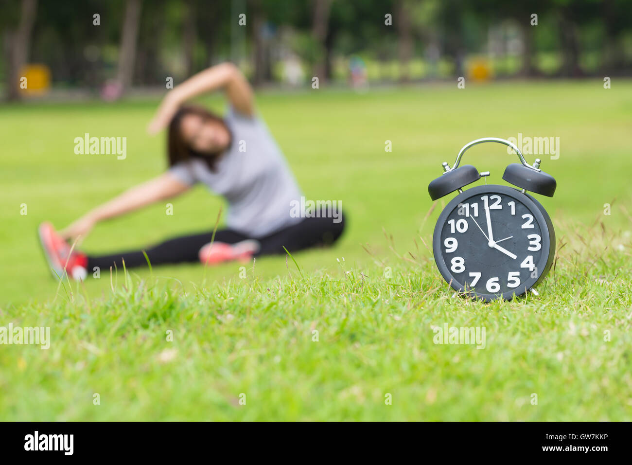 Morning exercise and black clock Stock Photo - Alamy
