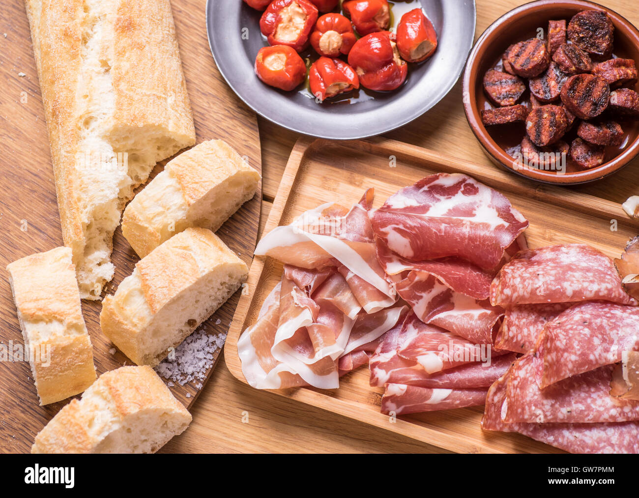 Tapas food, served in small bowls cold meat, goat cheese. A meal for ...