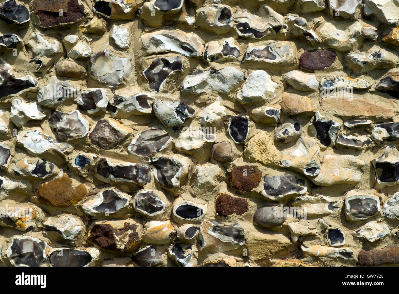 Decorative flint built wall on Cranbourne village church, Dorset, UK ...
