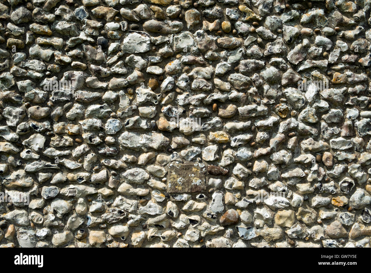 Decorative flint built wall on Cranbourne village church, Dorset, UK ...