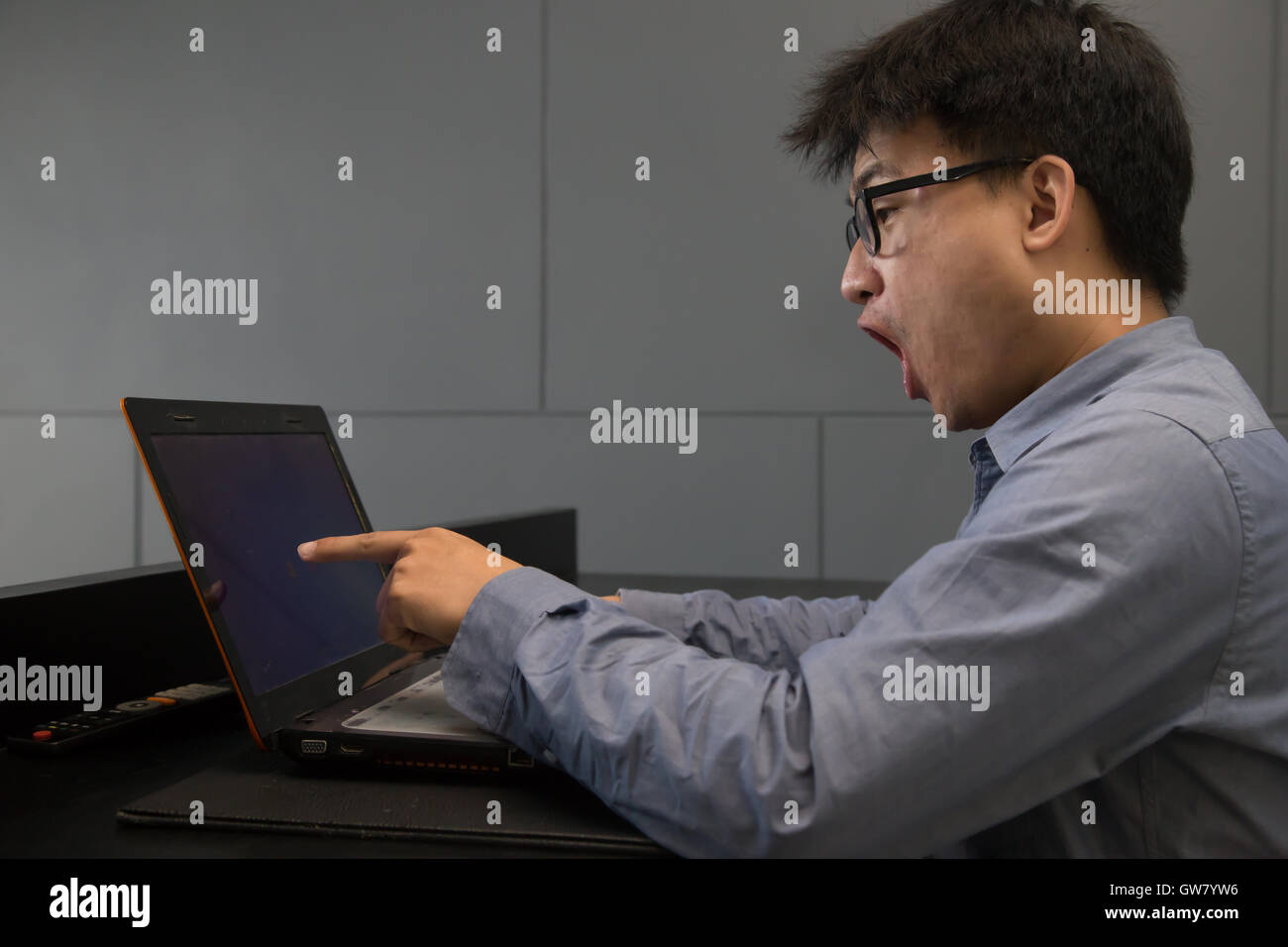 Surprised man looking computer screen hi-res stock photography and ...