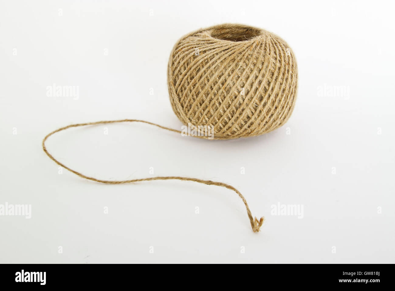 A ball of string isolated on white Stock Photo - Alamy