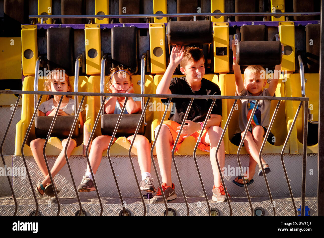 Two children waiting for ride hi-res stock photography and images - Alamy