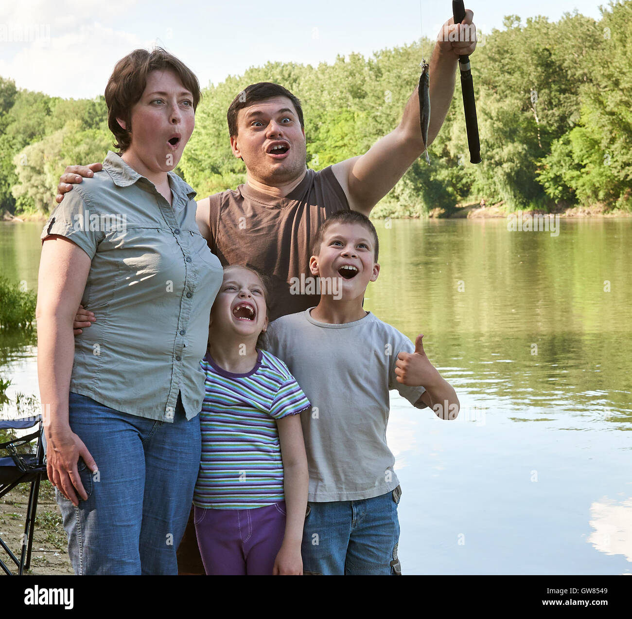 family with emotion catch fish, people camping and fishing, leisure in ...