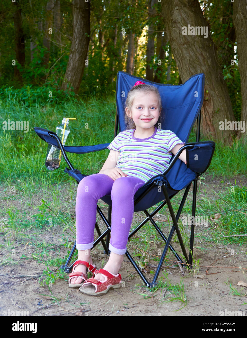girl child sit on chair in forest at family picnic Stock Photo - Alamy