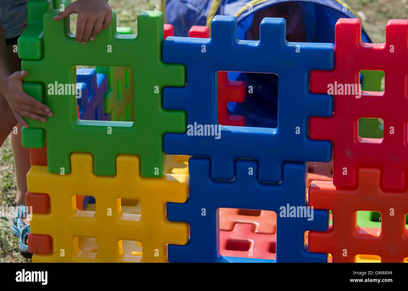 kids play with bricks in the garden Stock Photo - Alamy
