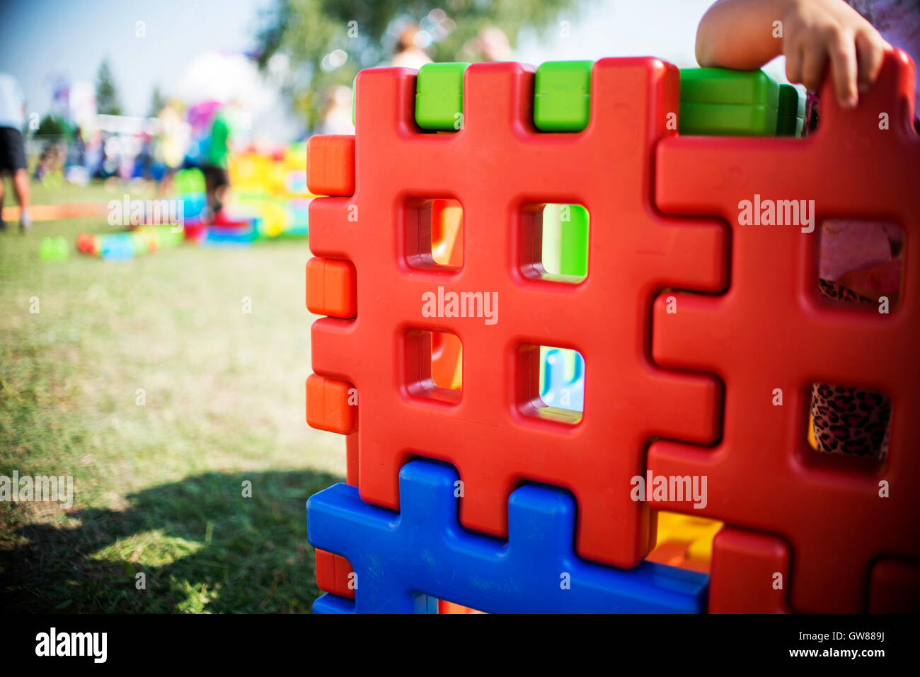 kids play with bricks in the garden Stock Photo - Alamy