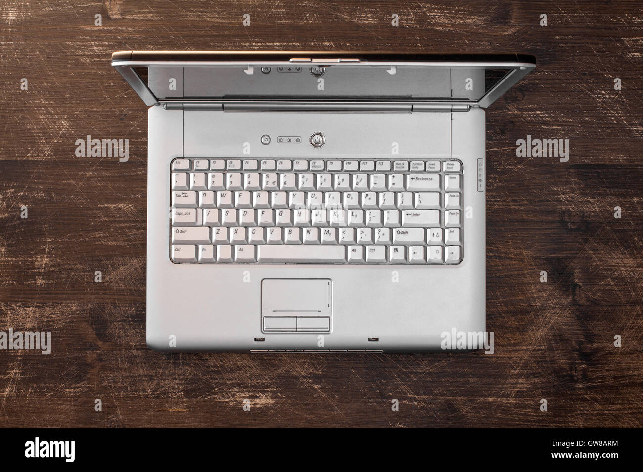 Open laptop computer on the wooden desk. Top view Stock Photo - Alamy