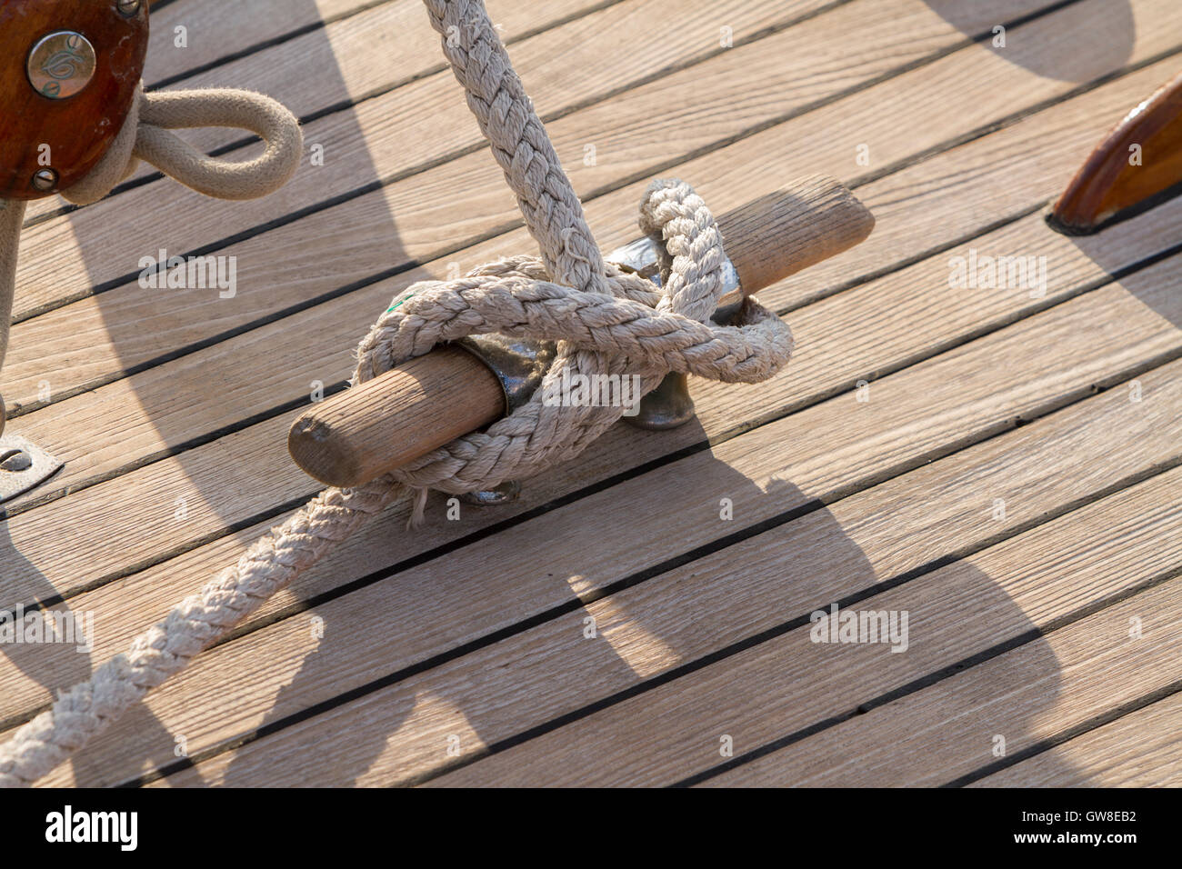 Line fixed to a cleat on a classic sailing yacht Stock Photo - Alamy