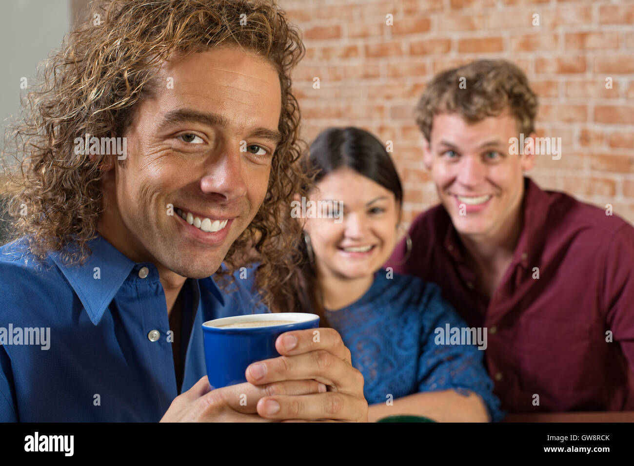 Smiling Man with Coffee Stock Photo - Alamy