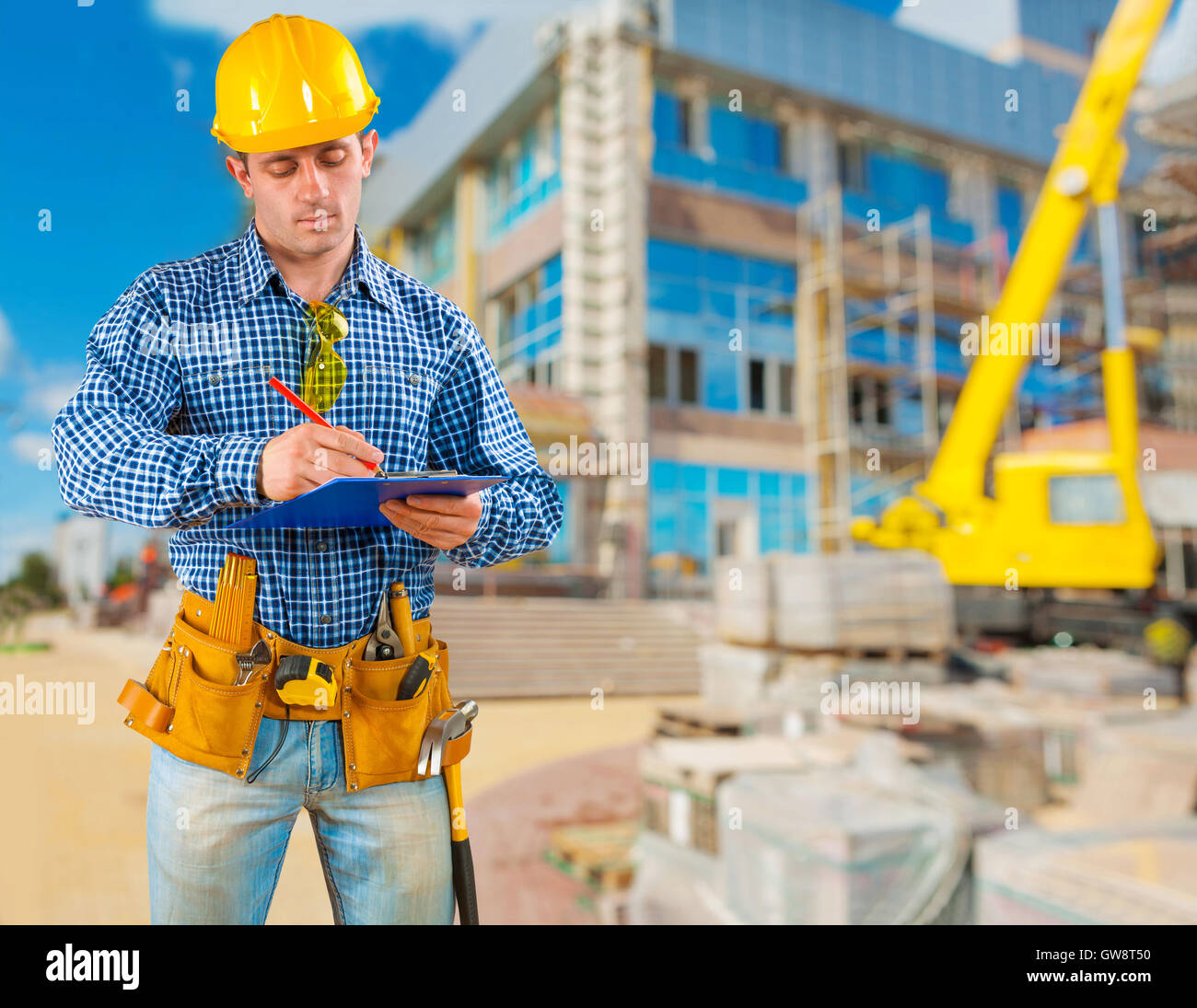 contractor writing in clipboard Stock Photo - Alamy