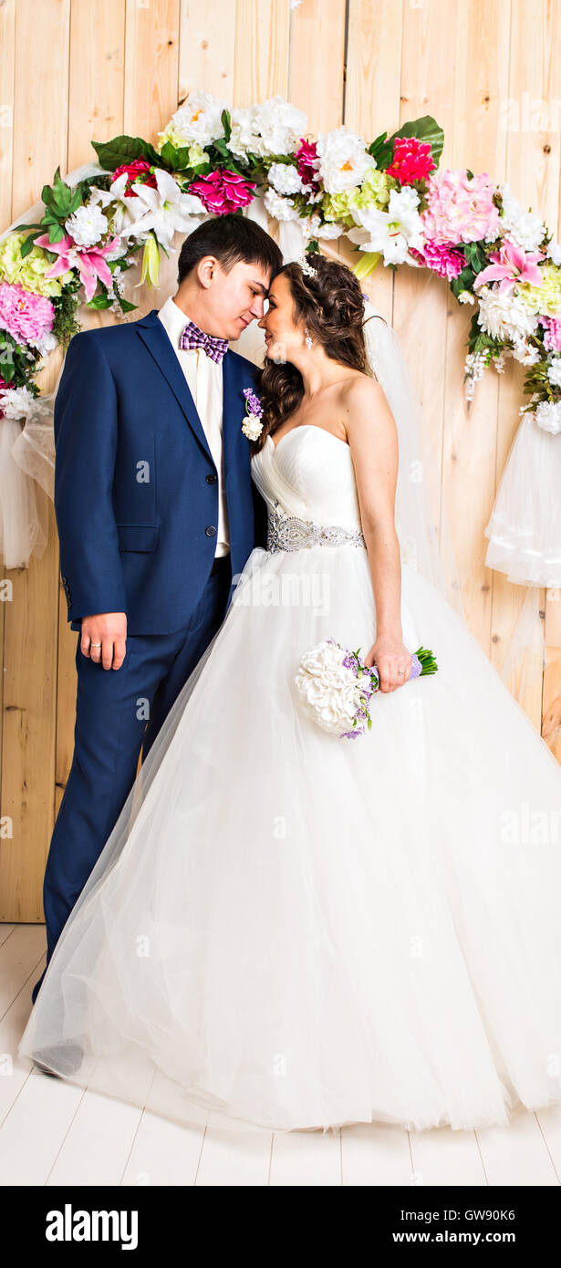 Full length portrait of a young bride and groom posing together Stock ...