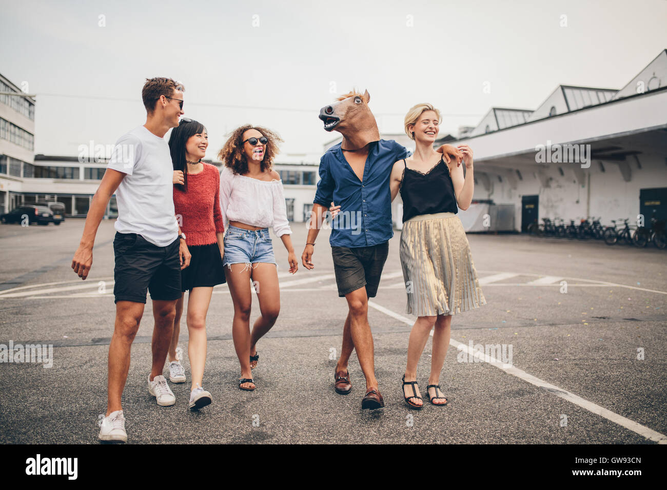 Full length shot of young friends enjoying together on the street ...