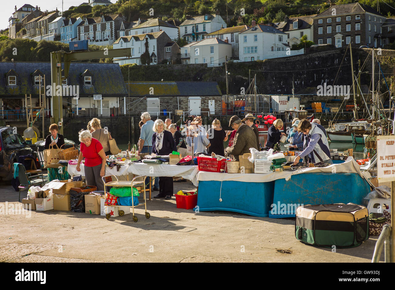 Charity fundraising stalls on the quayside in Mevagissey village in ...