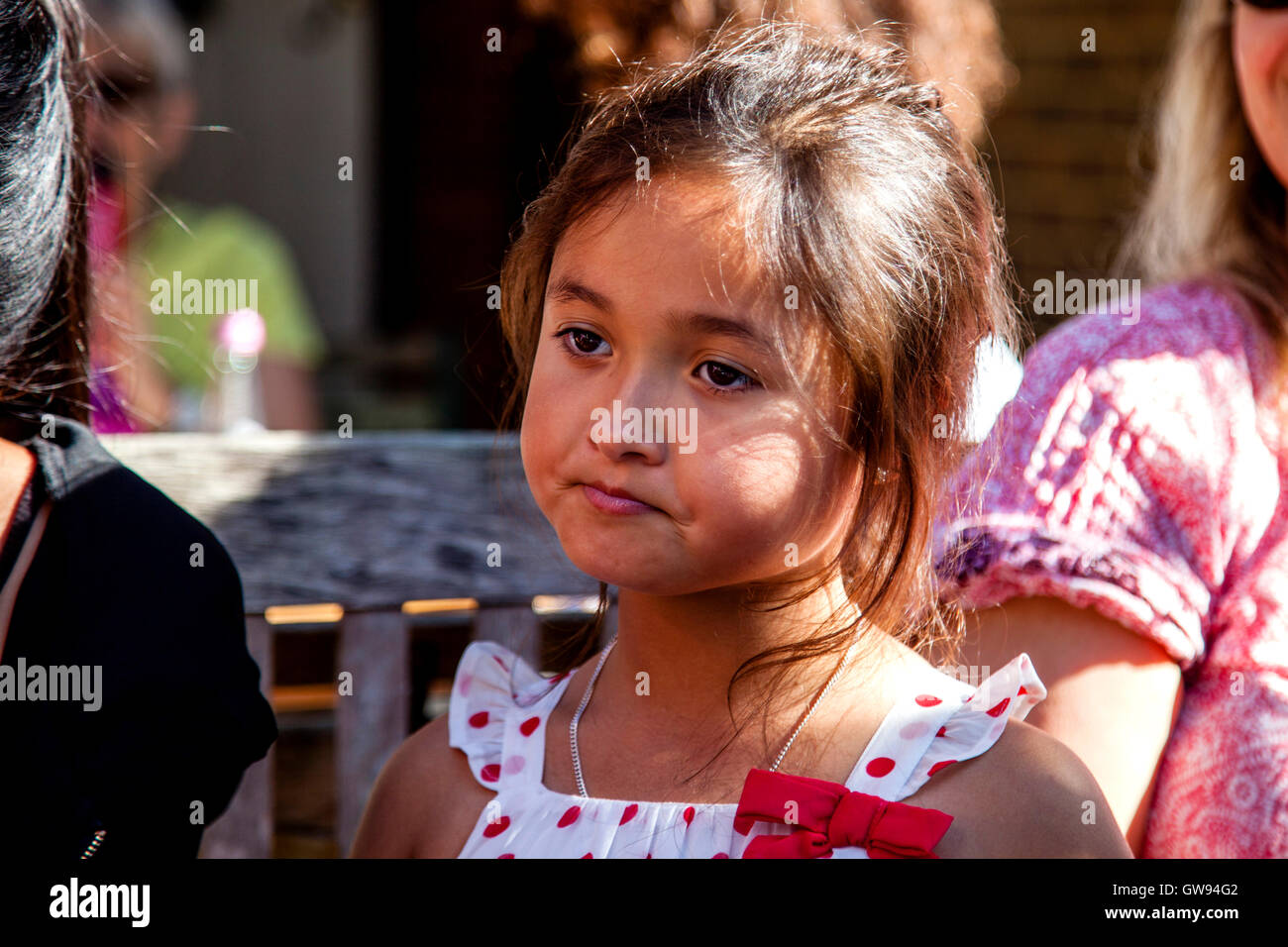 A Child With A Resigned Expression On Her Face Stock Photo - Alamy