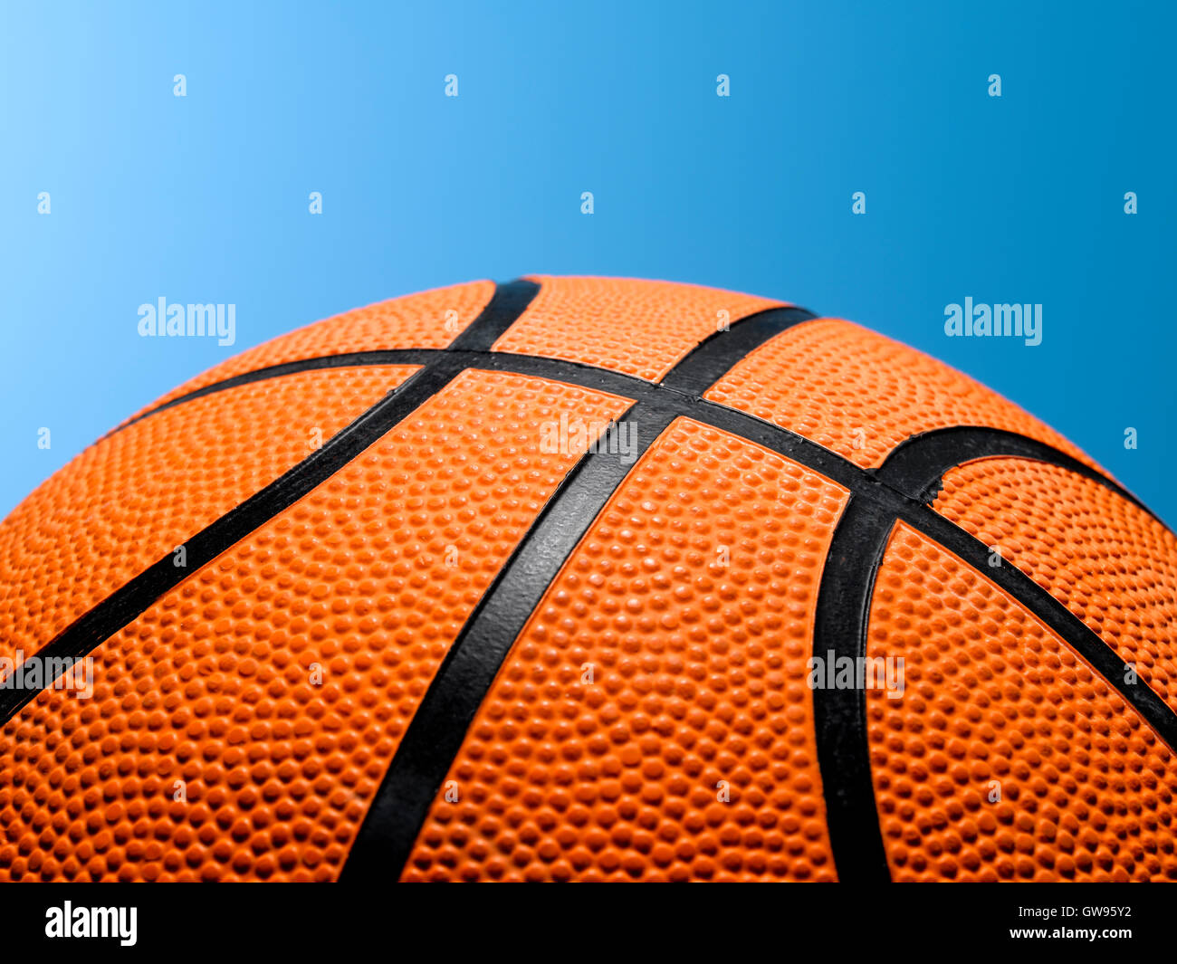 Single Basketball on blue Stock Photo - Alamy