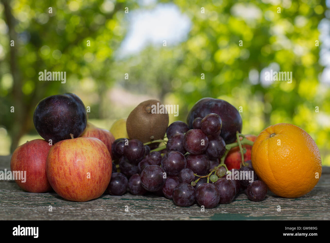 fruits in wooden table, outdoor Stock Photo - Alamy