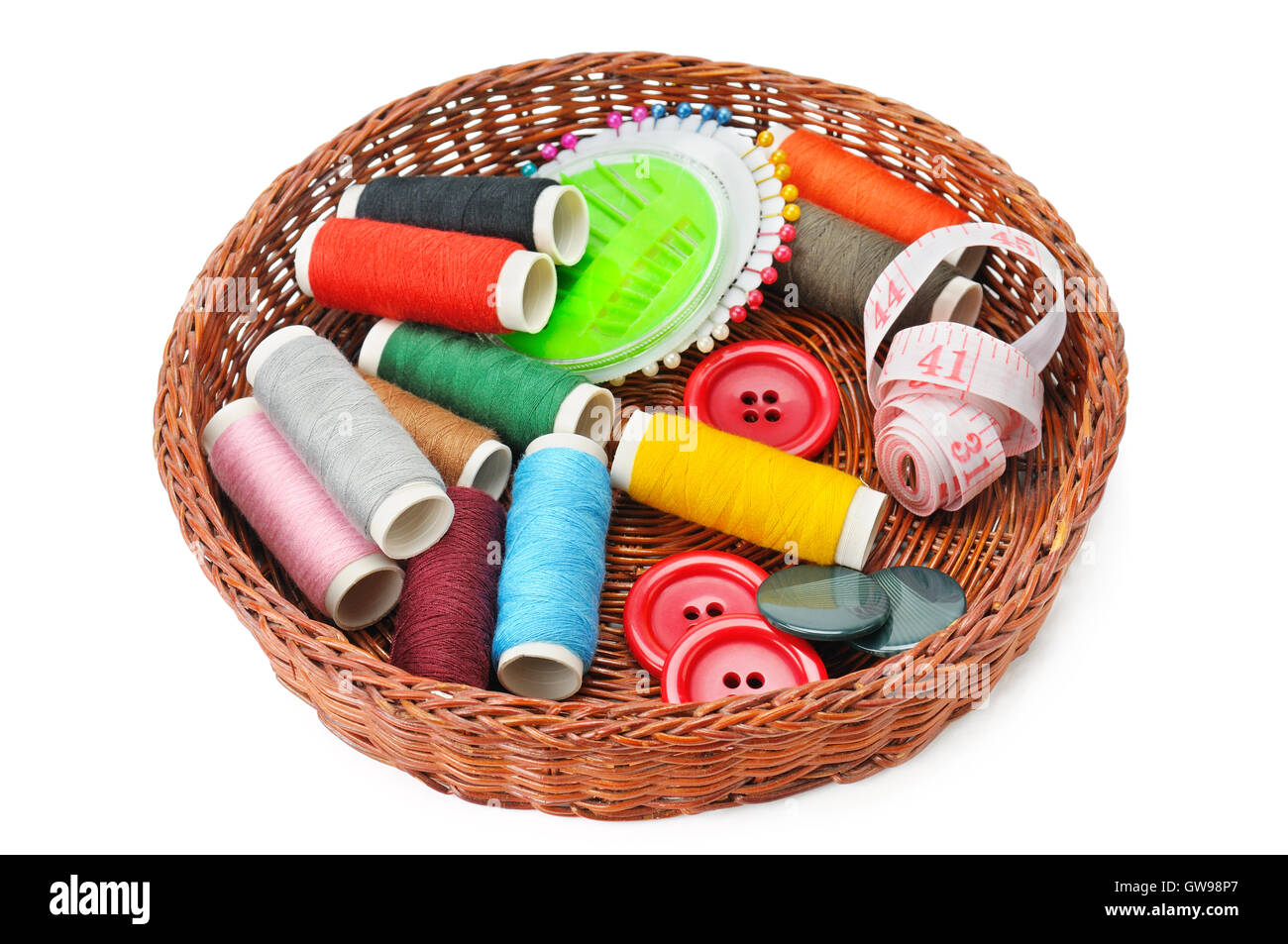 thread and buttons in a basket isolated on white background Stock Photo ...