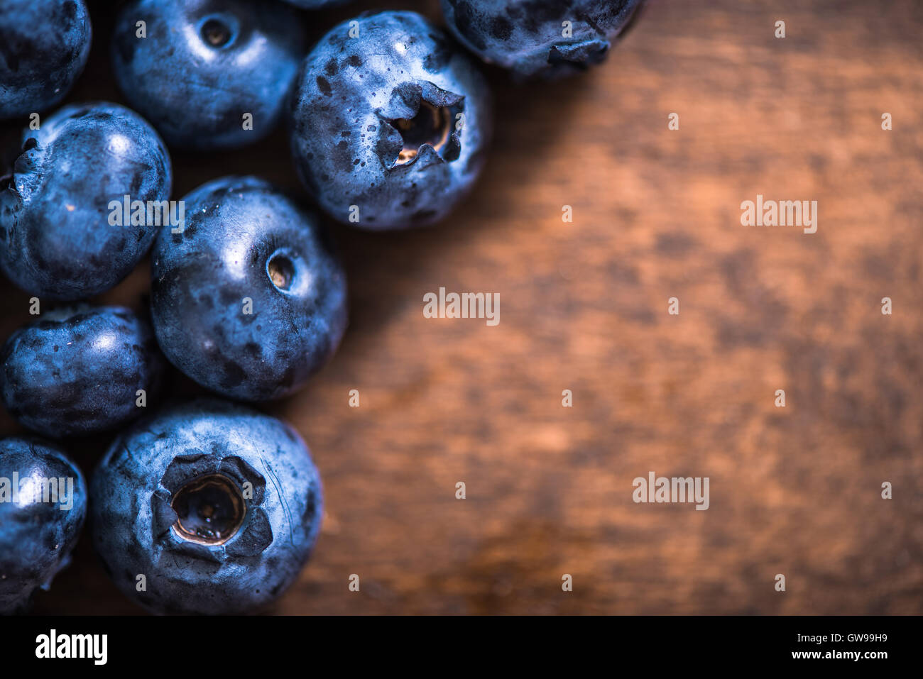 Blueberries on wooden background, macro close up view Stock Photo - Alamy
