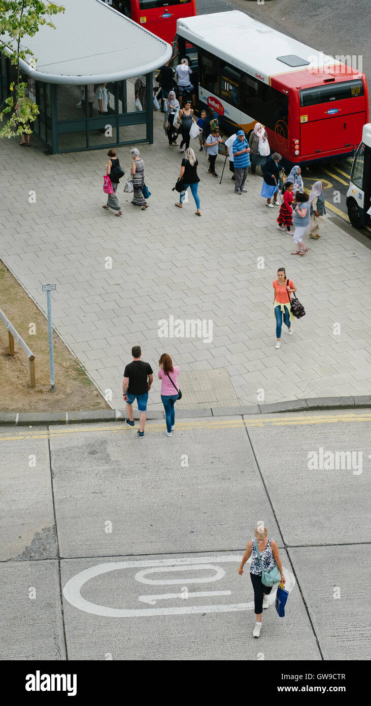 People getting off bus viewed from above Stock Photo - Alamy