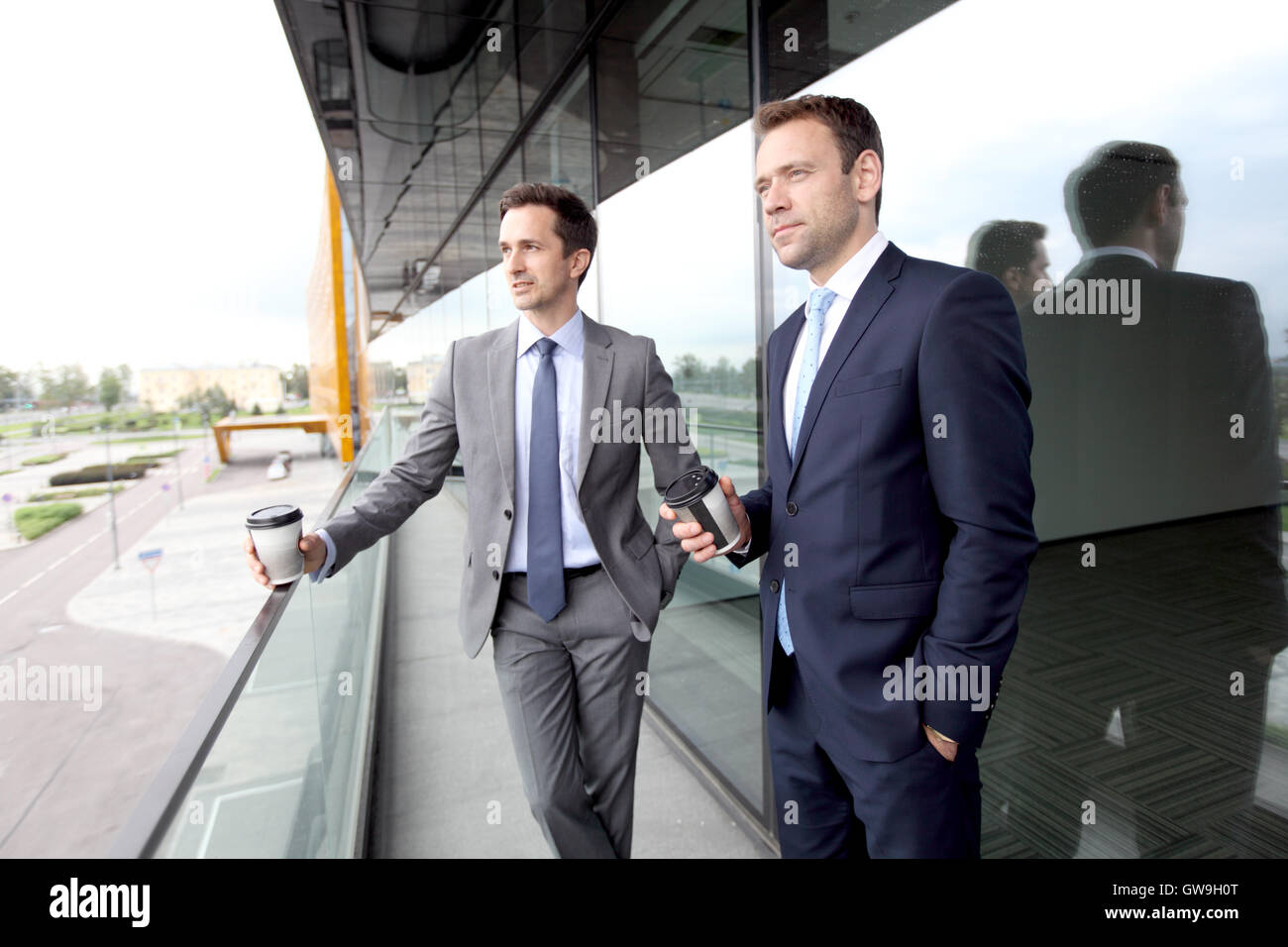 Two people talking on balcony hi-res stock photography and images - Alamy