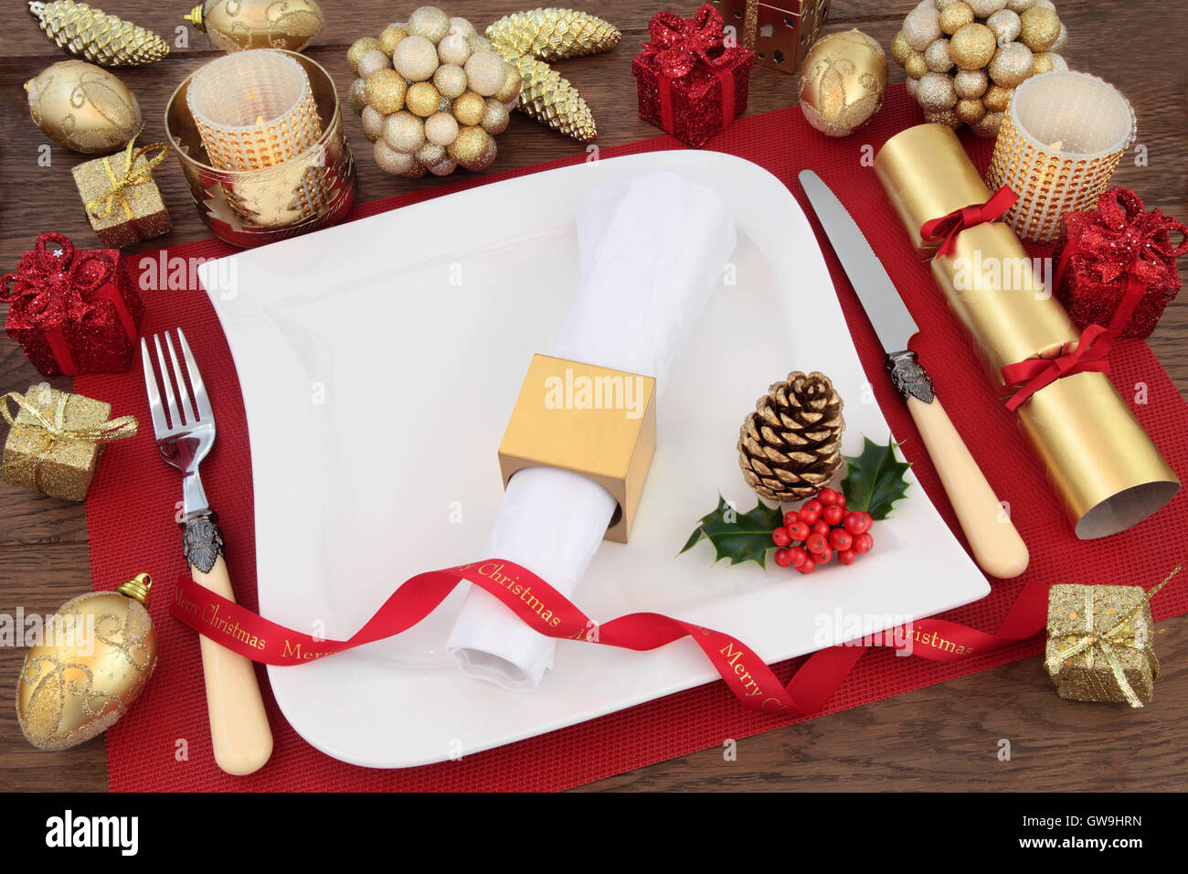 Luxury christmas dinner table setting with white plate, linen serviette ...