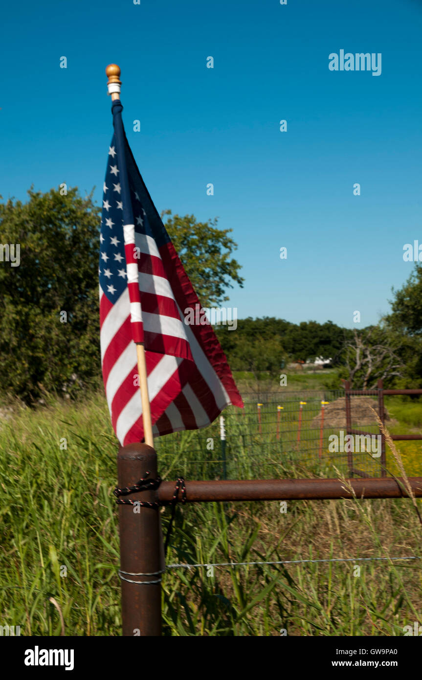 United States flag flying from a farm gatepost in rural Collin County ...