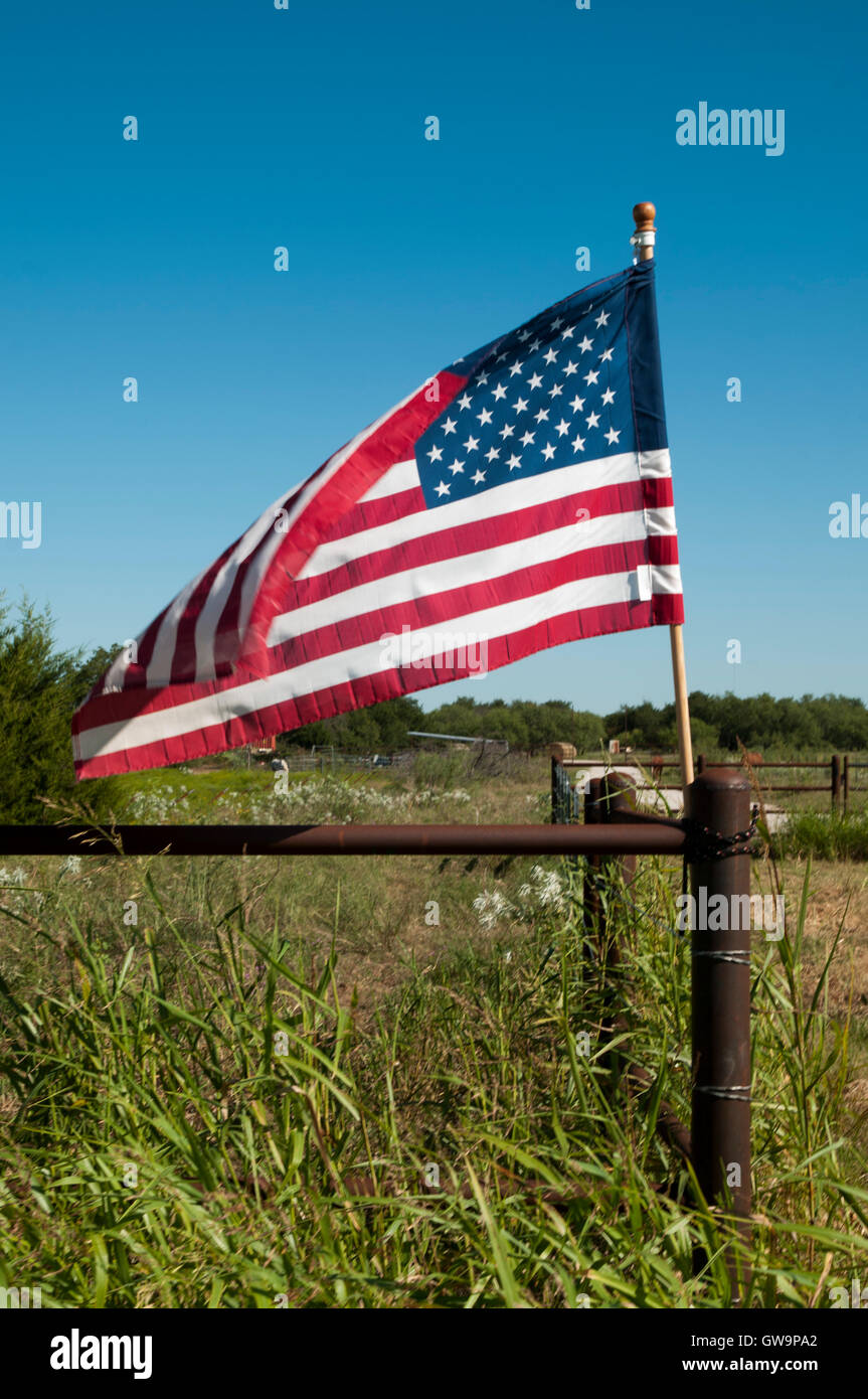 United States flag flying from a farm gatepost in rural Collin County ...