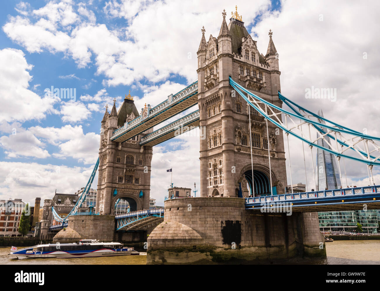Boat passing under Tower Bridge, London, UK Stock Photo - Alamy