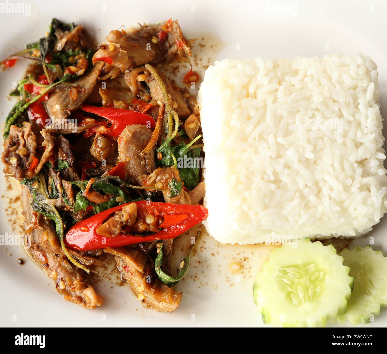 A fresh dish of Thai style food, Fried pork with sweet basi Stock Photo ...