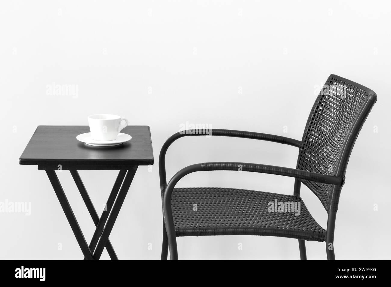 Chair, table and teacup Stock Photo - Alamy