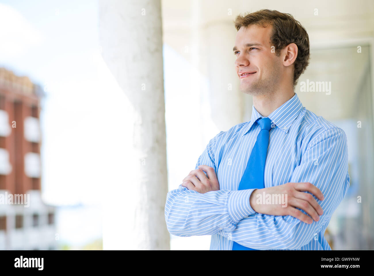 successful young businessman smiling Stock Photo - Alamy