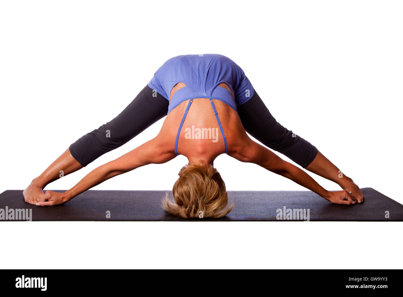 Head on floor yoga inversion pose Stock Photo - Alamy