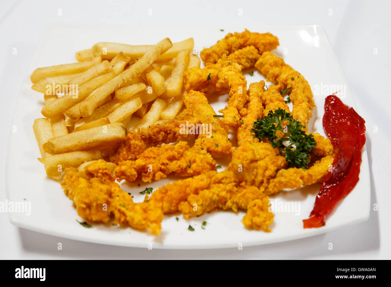 fried fish fingers on plate with french fries Stock Photo - Alamy