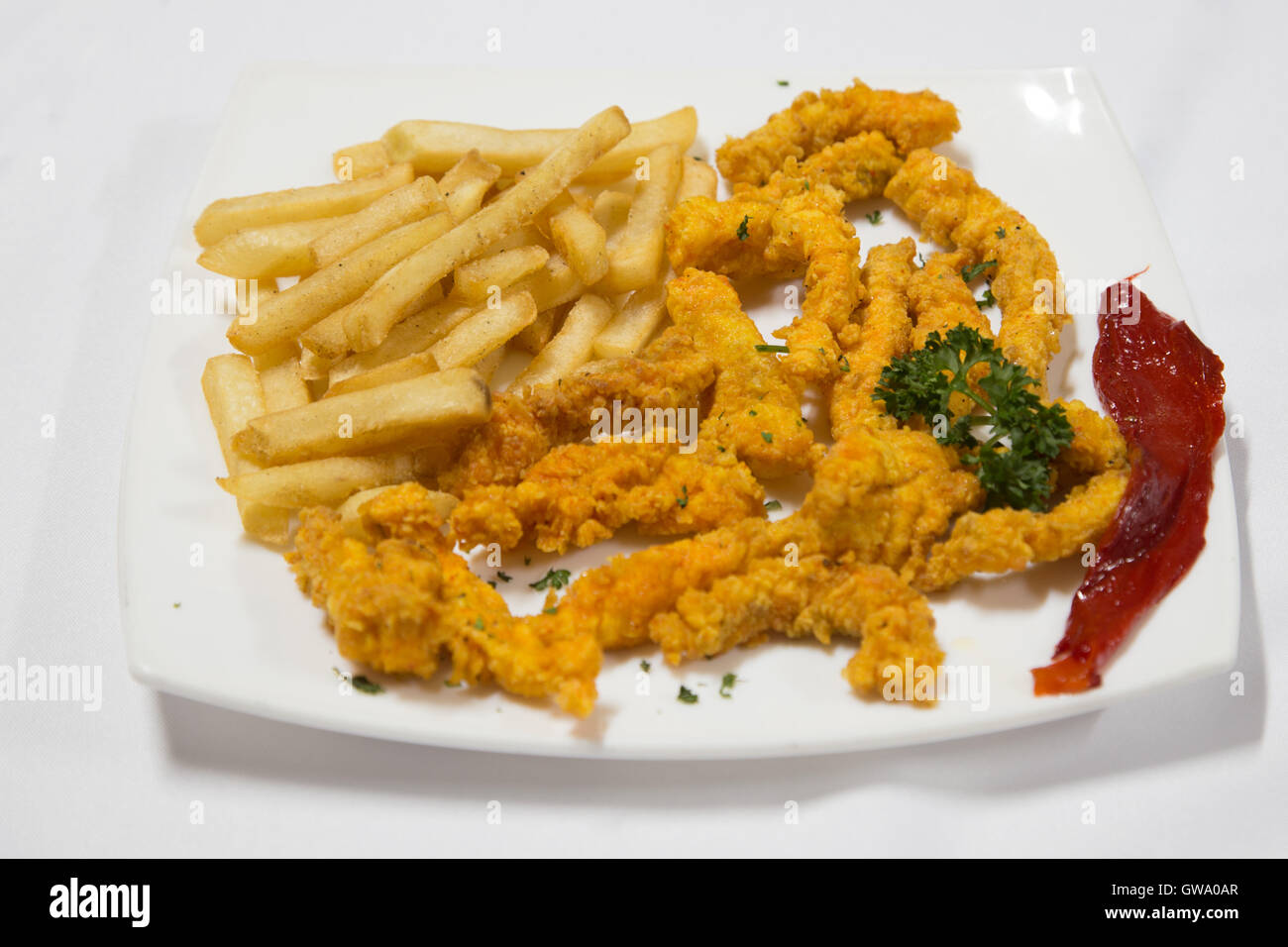 fried fish fingers on plate with french fries Stock Photo - Alamy