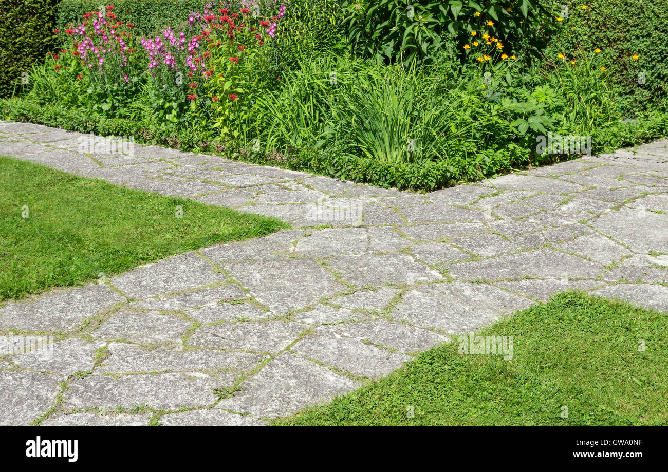 Stone paths crossing in a garden Stock Photo - Alamy