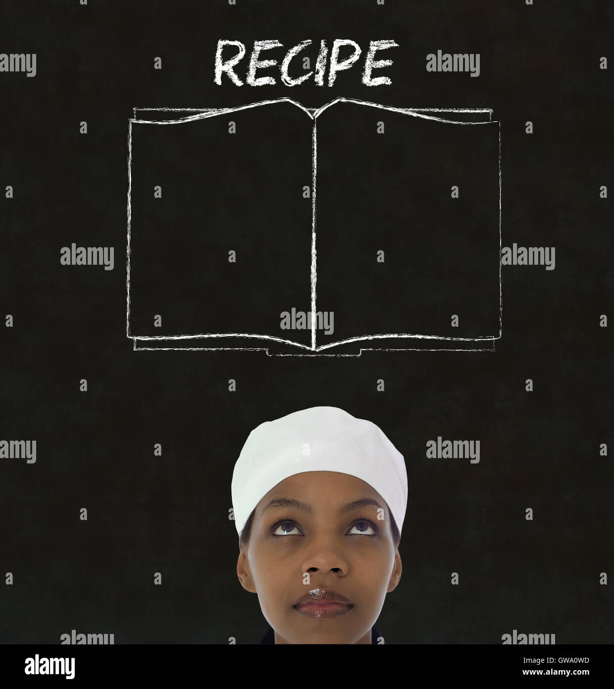 Chef with recipe book on chalk blackboard menu background Stock Photo ...