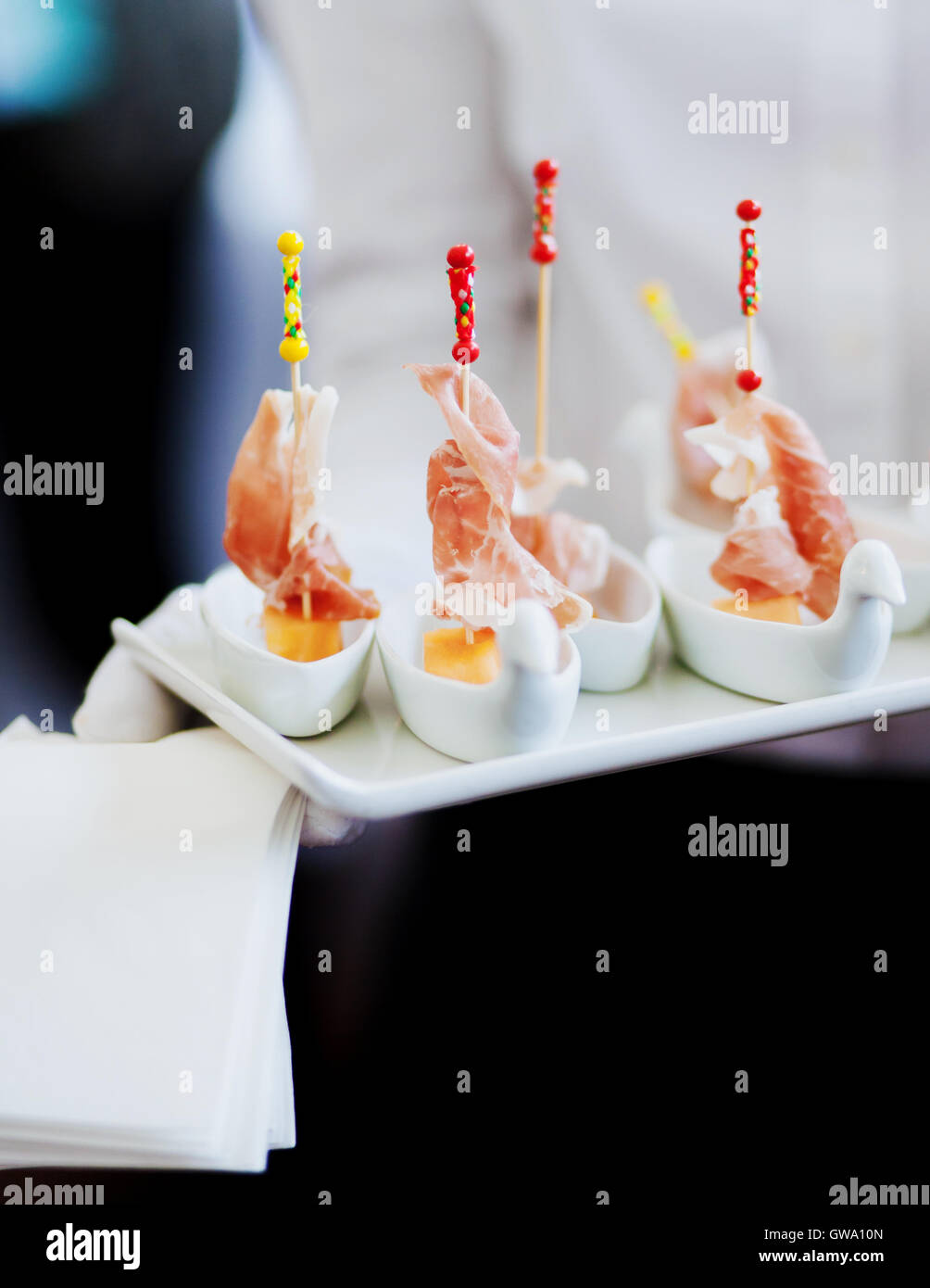 Smoked ham and melon canapes Stock Photo - Alamy