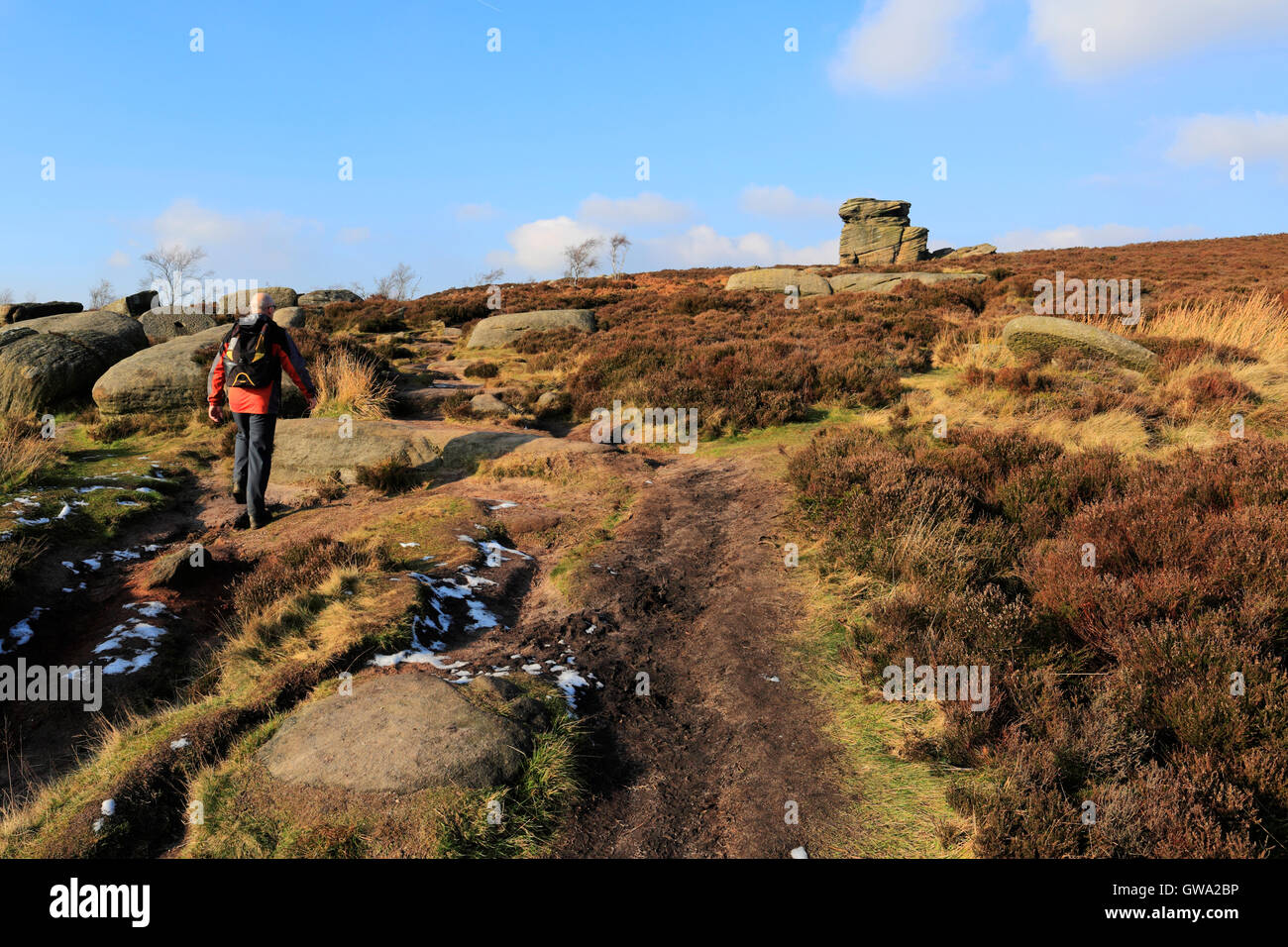 Walker at the Mother Cap Gritstone rock formation, Millstone Edge ...