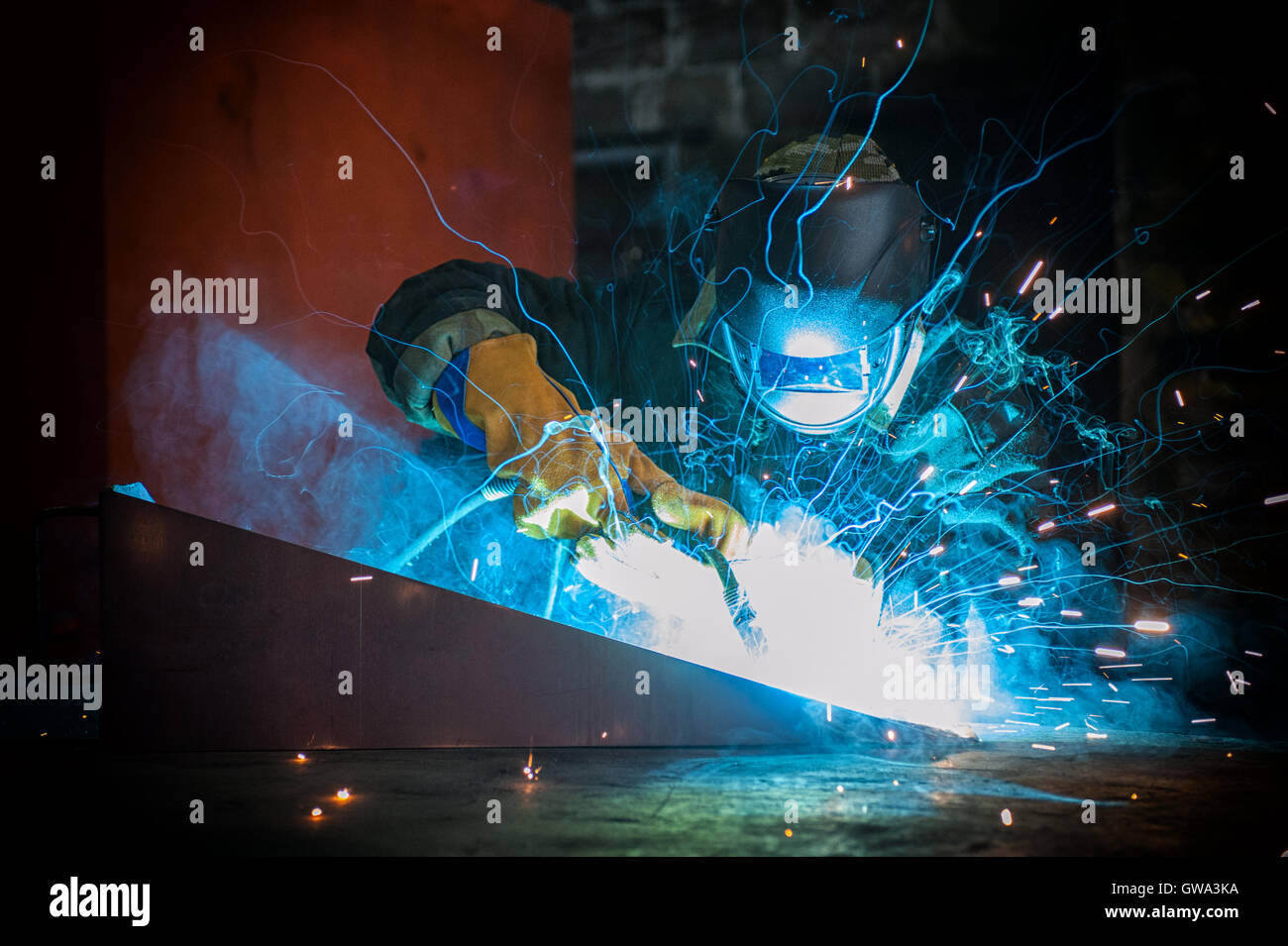 worker welding metal Stock Photo - Alamy