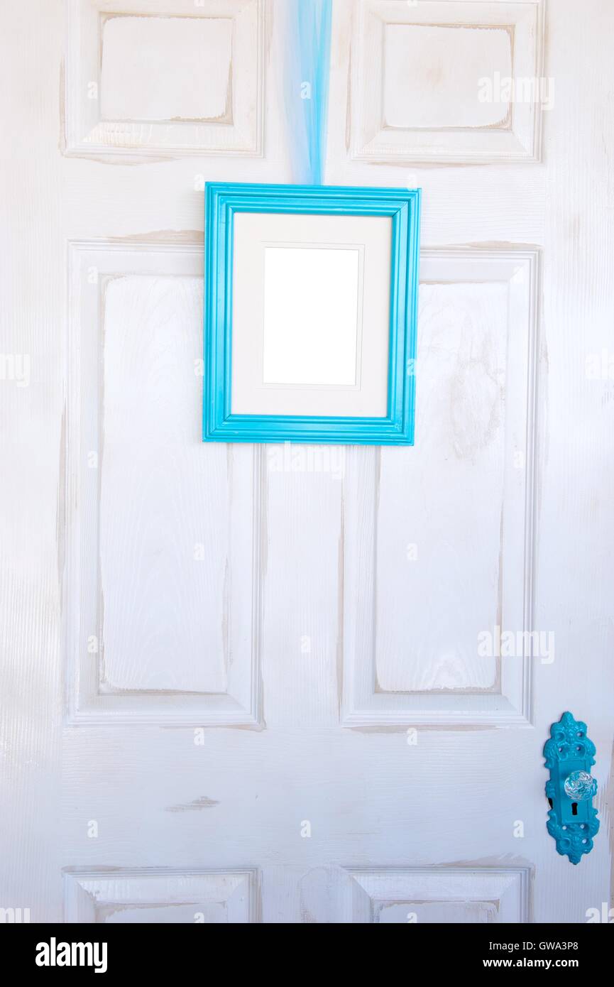 Blank Turquoise Picture Frame on Distressed Door Stock Photo - Alamy