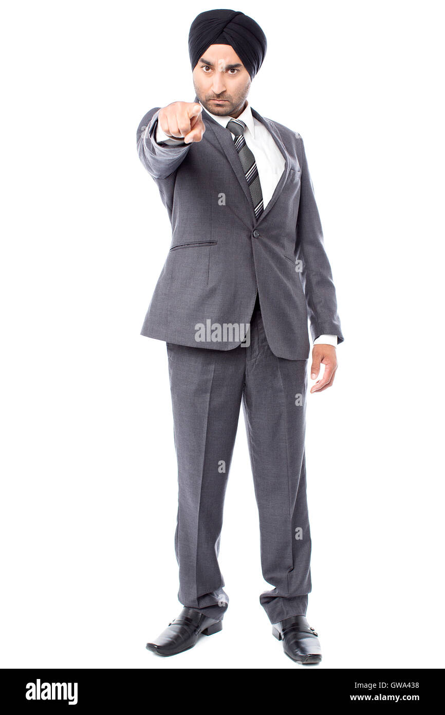 Angry businessman pointing towards you Stock Photo - Alamy