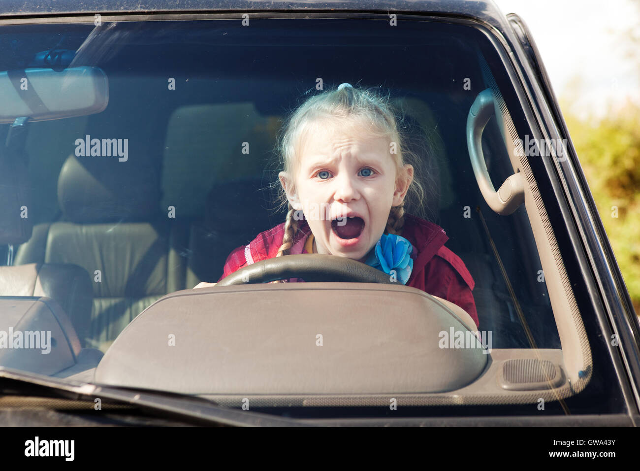 Crying scared girl in the car Stock Photo - Alamy