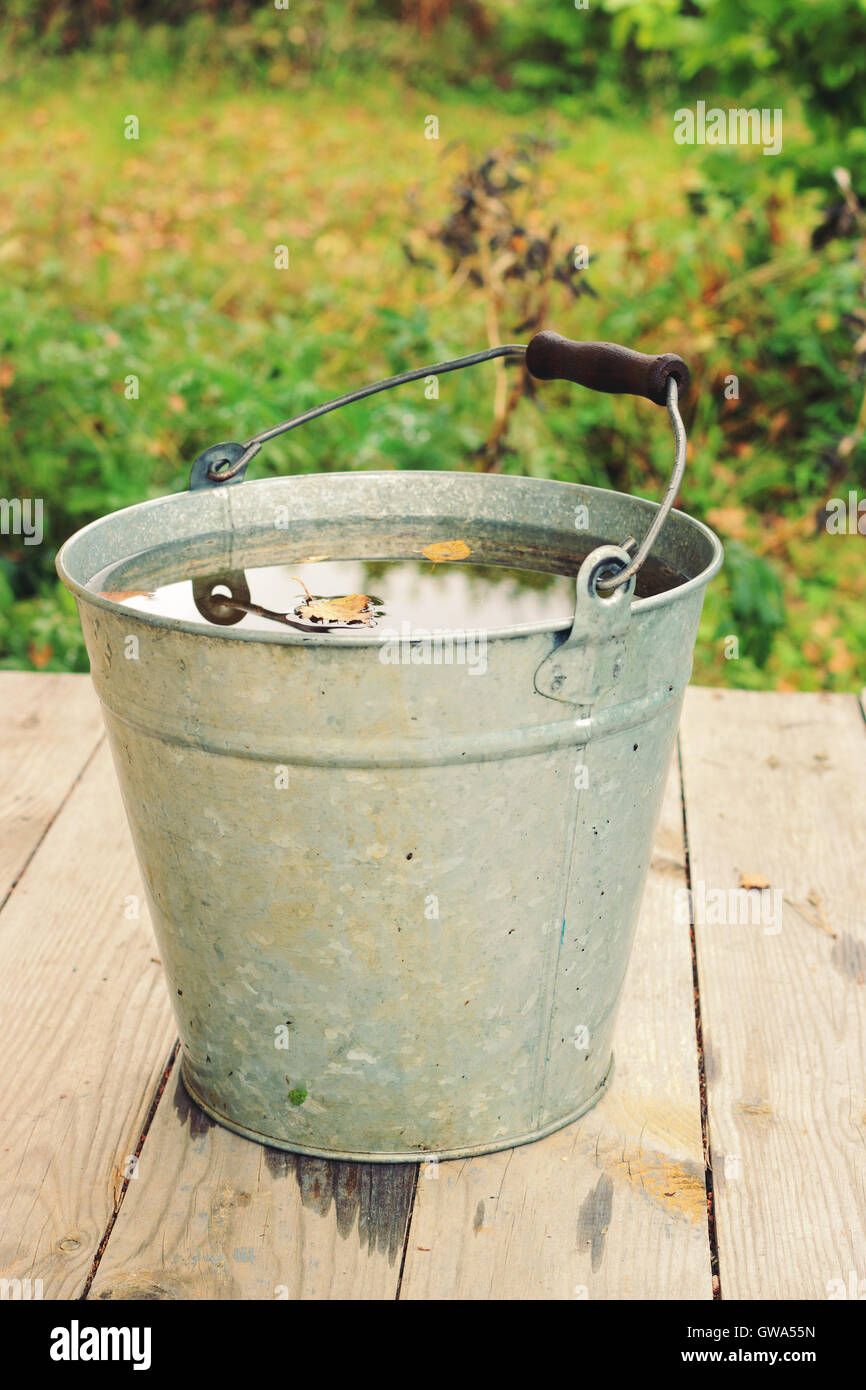 Bucket rain water outdoors hi-res stock photography and images - Alamy