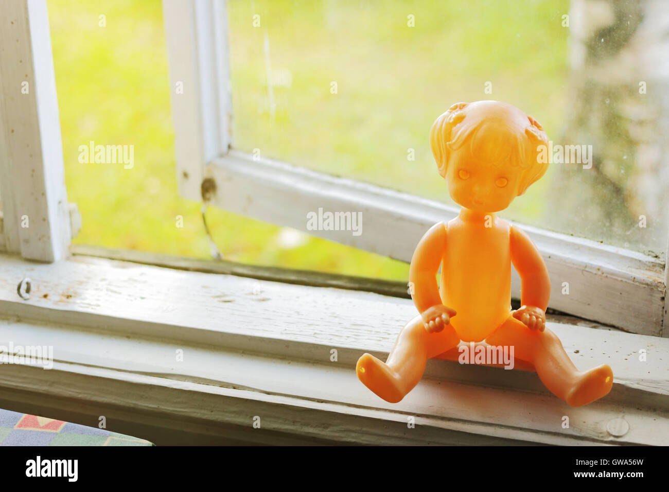 Vintage plastic doll on the window sill. Mass production in USSR, 1970 ...