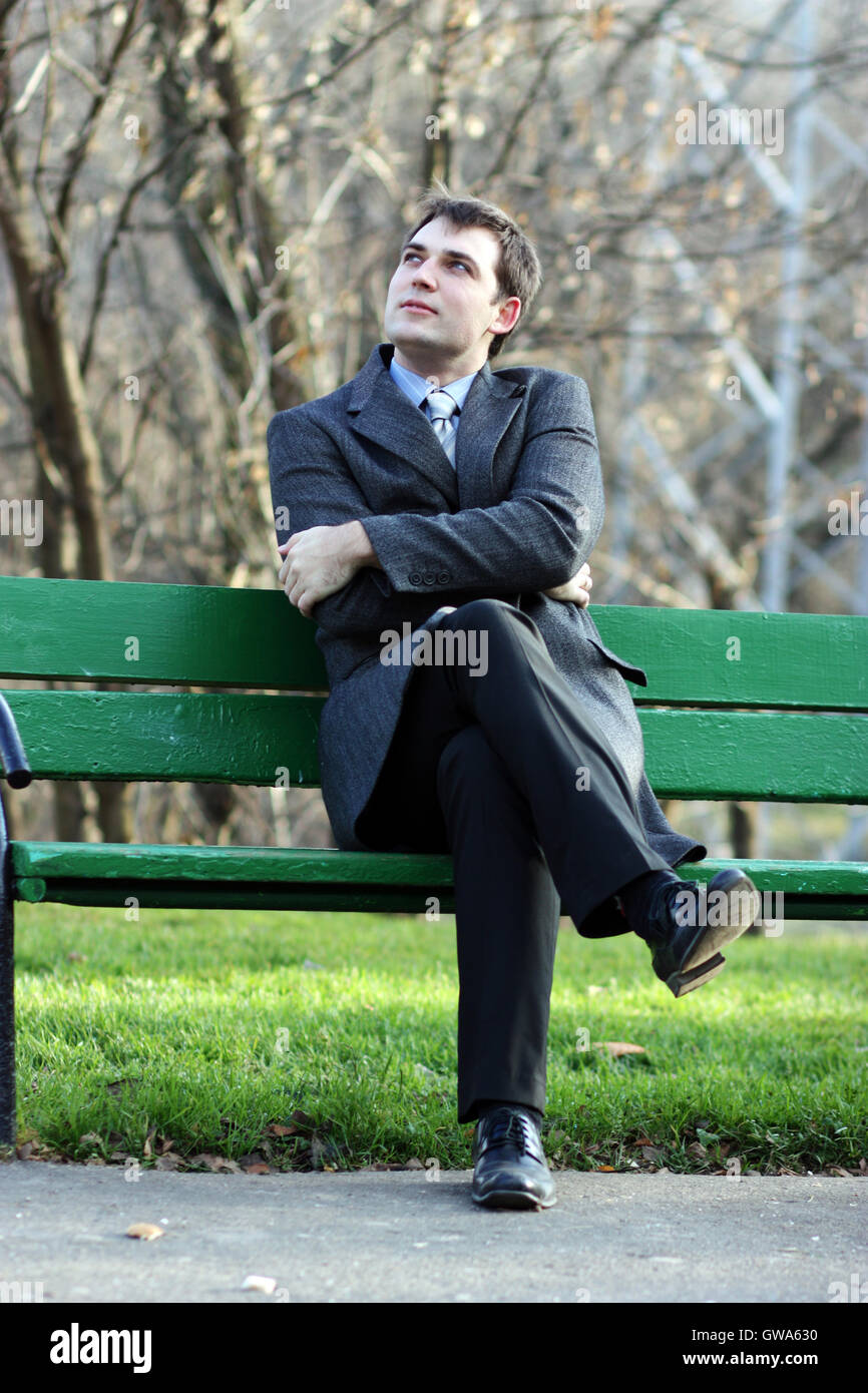 Young business man waiting for meeting at green park Stock Photo - Alamy
