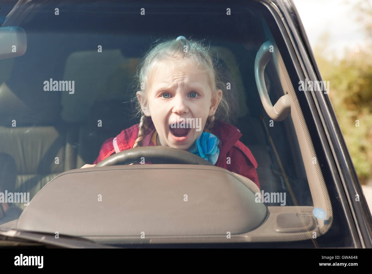 Crying scared girl in the car Stock Photo - Alamy
