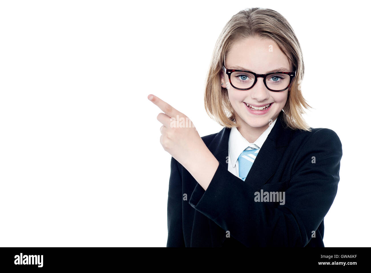 Bespectacled business girl pointing away Stock Photo - Alamy