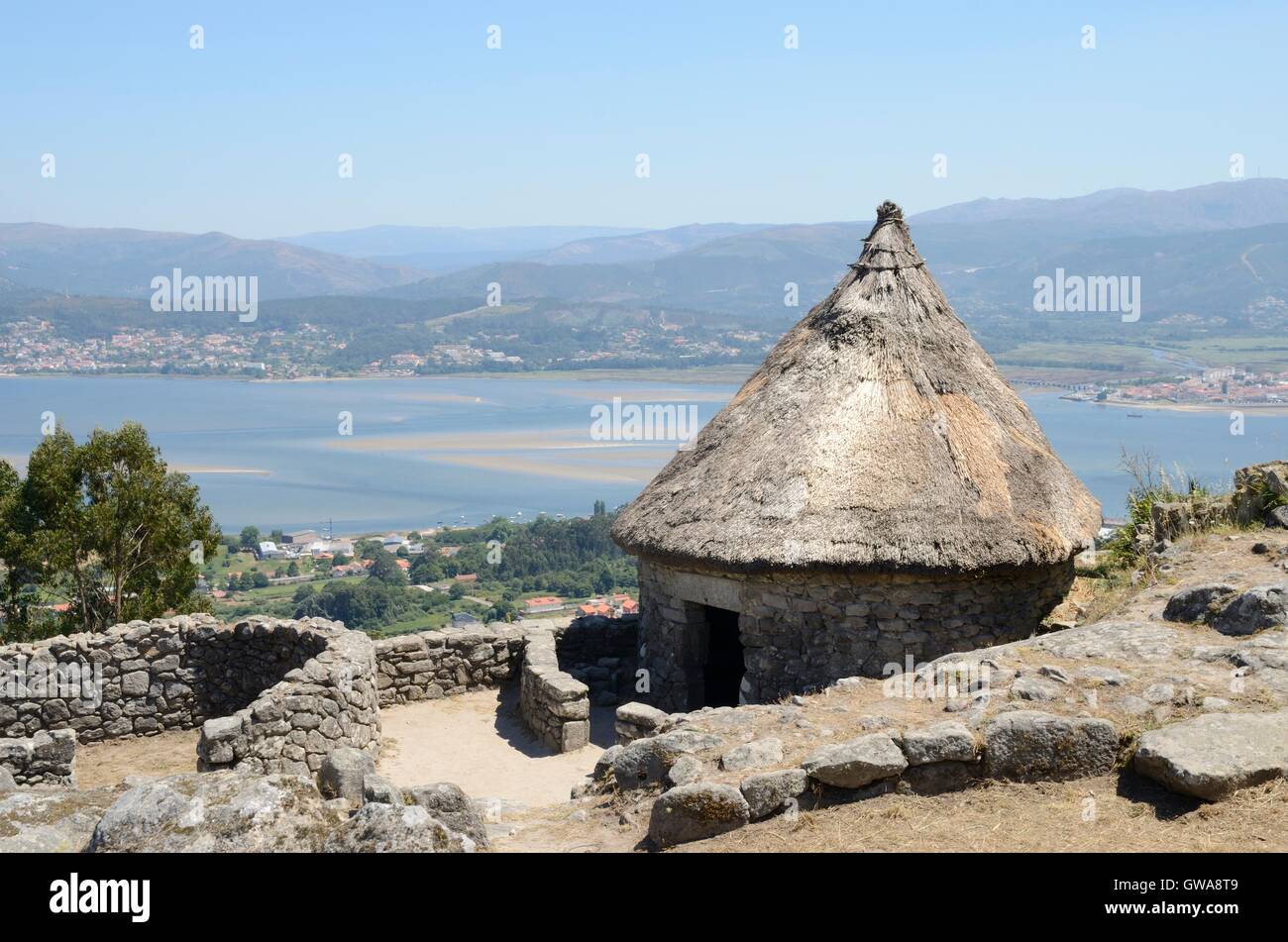 One of the reconstructed houses in the remains of a celtic settlement ...