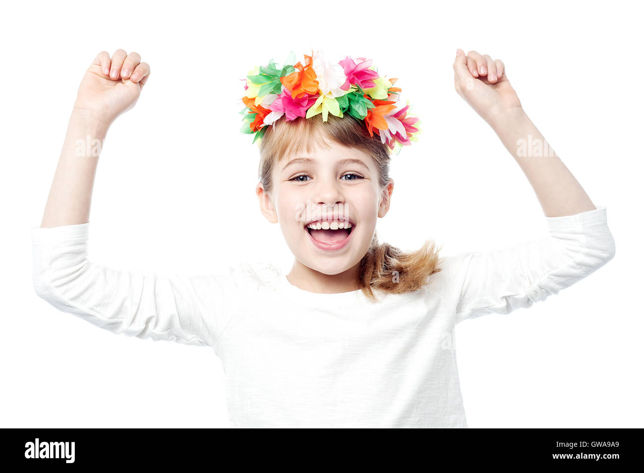 Excited charming kid raising her arms up Stock Photo - Alamy